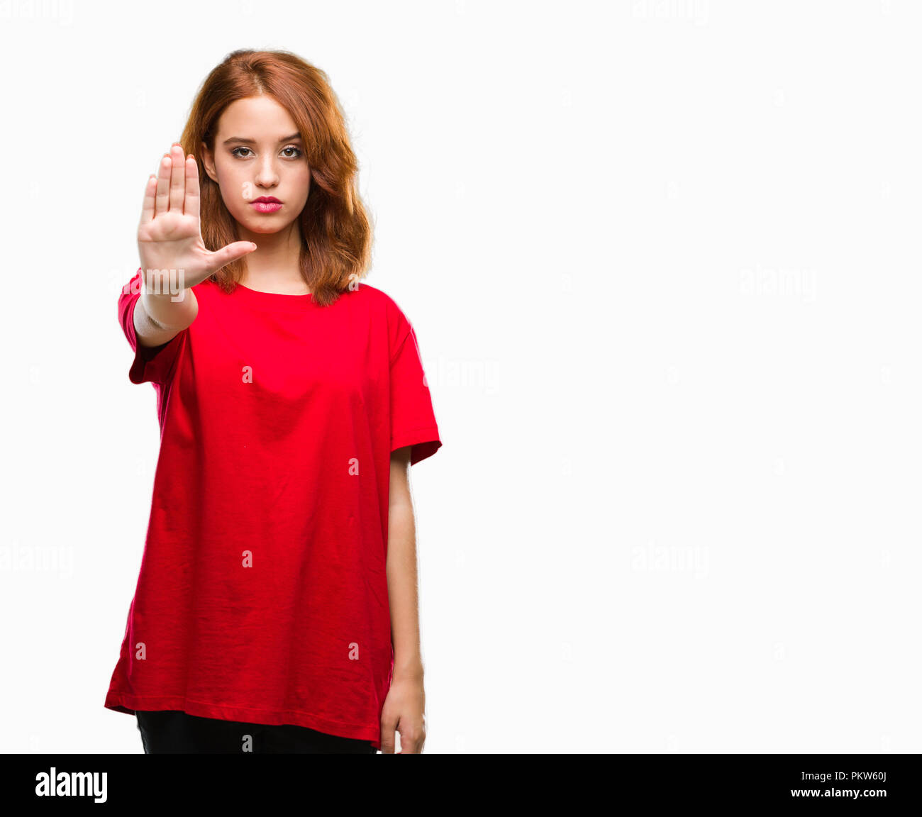 Young beautiful woman over isolated background doing stop sing with ...