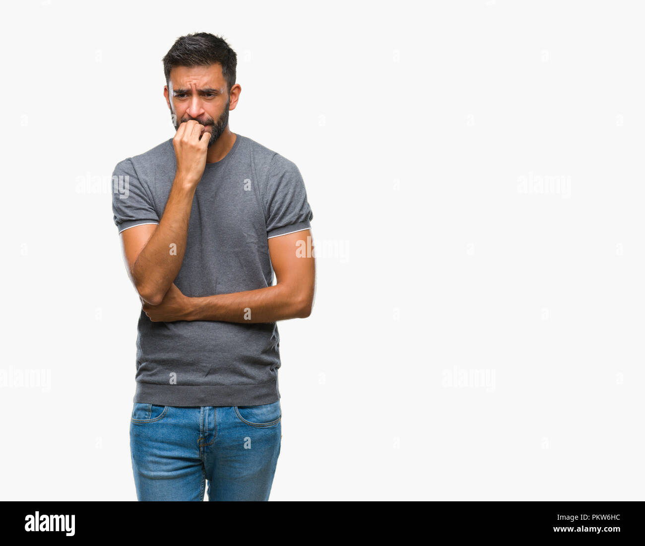 Adult hispanic man over isolated background looking stressed and ...