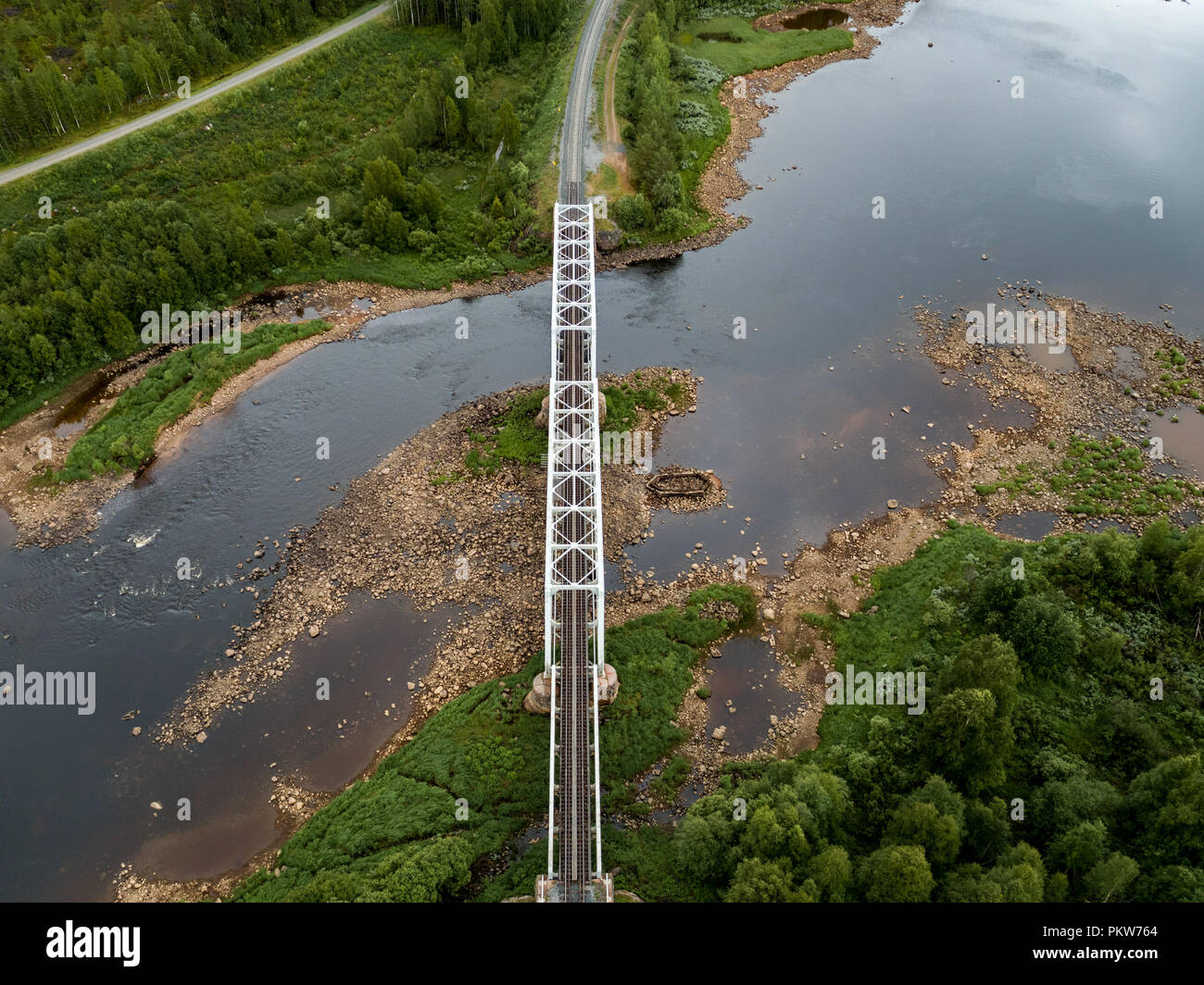 Steel railroad bridge over river in northern Finland seen from the air ...
