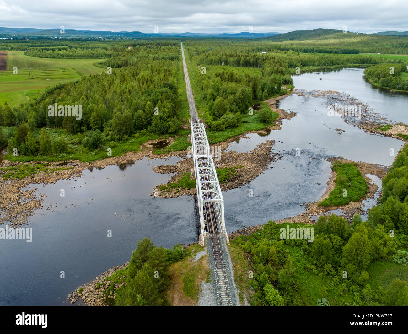Steel railroad bridge over river in northern Finland seen from the air ...