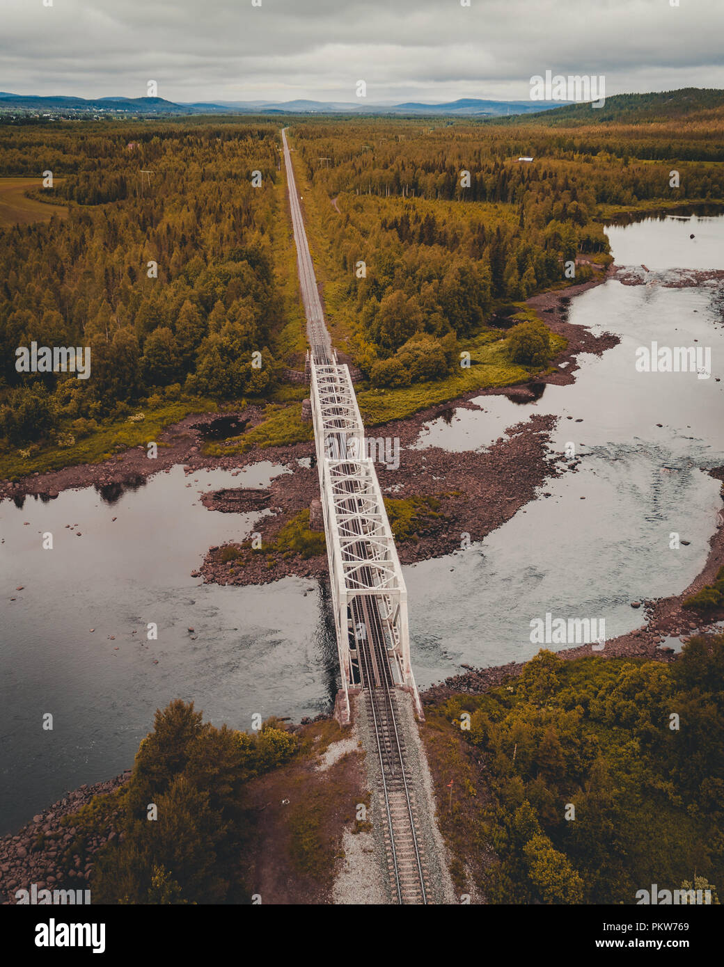 Steel railroad bridge over river in northern Finland seen from the air ...