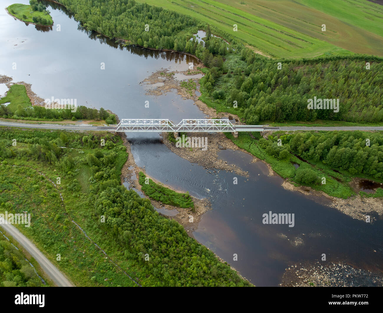 Steel railroad bridge over river in northern Finland seen from the air ...