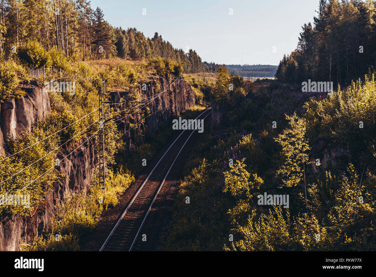Railroad track in the ridge on a sunny day, Finland Stock Photo - Alamy