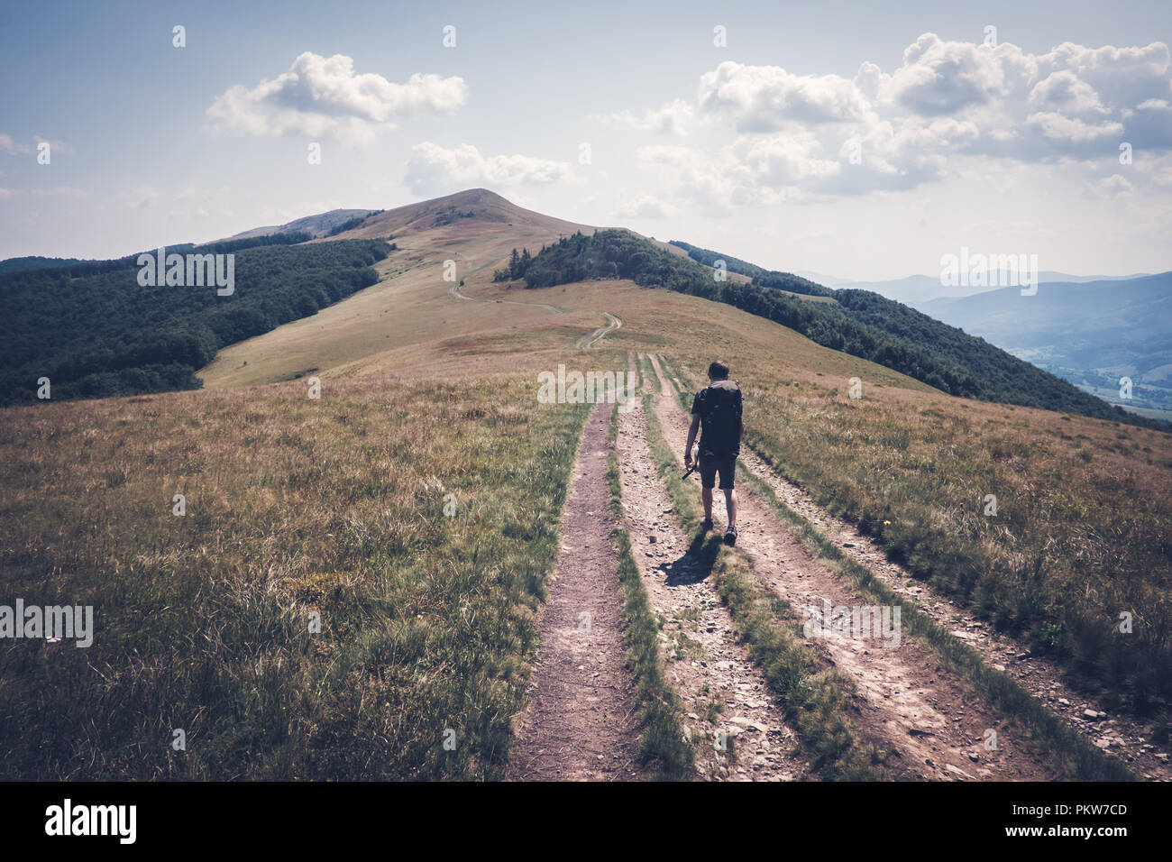 Young man hiking in the mountains hi-res stock photography and images ...