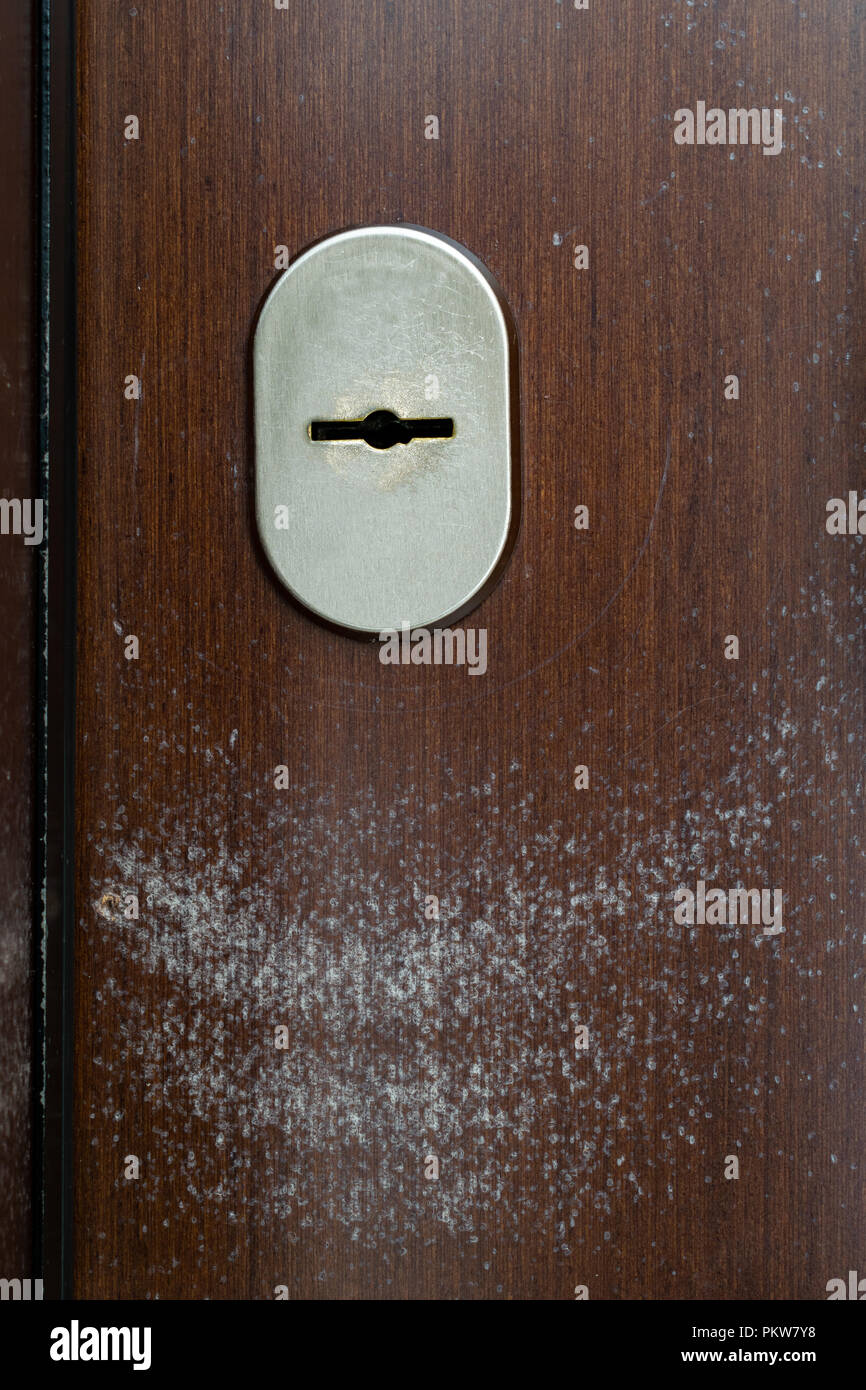 Entrance door wood worn from lock keys hitting the surface Stock Photo ...