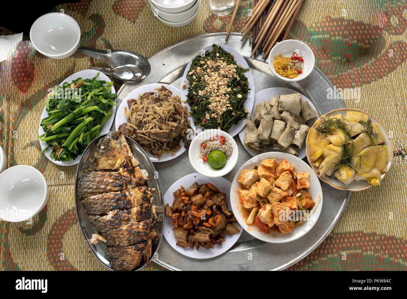 Vietnamese family lunch set: Rice, salad, boiled chicken, fried pork ...