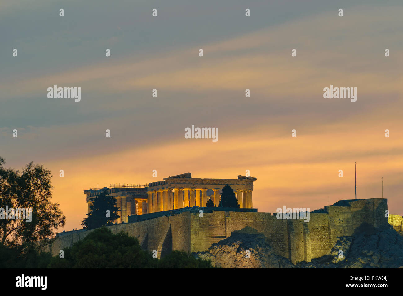 Acropolis, Parthenon view from Panathenaic stadium (Kallimarmaro) at sunset, with colorful sky ...