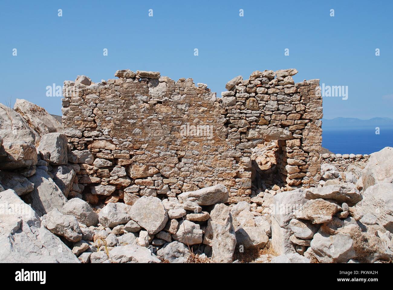 The ruins of the abandoned village of Mikro Chorio on the Greek island ...