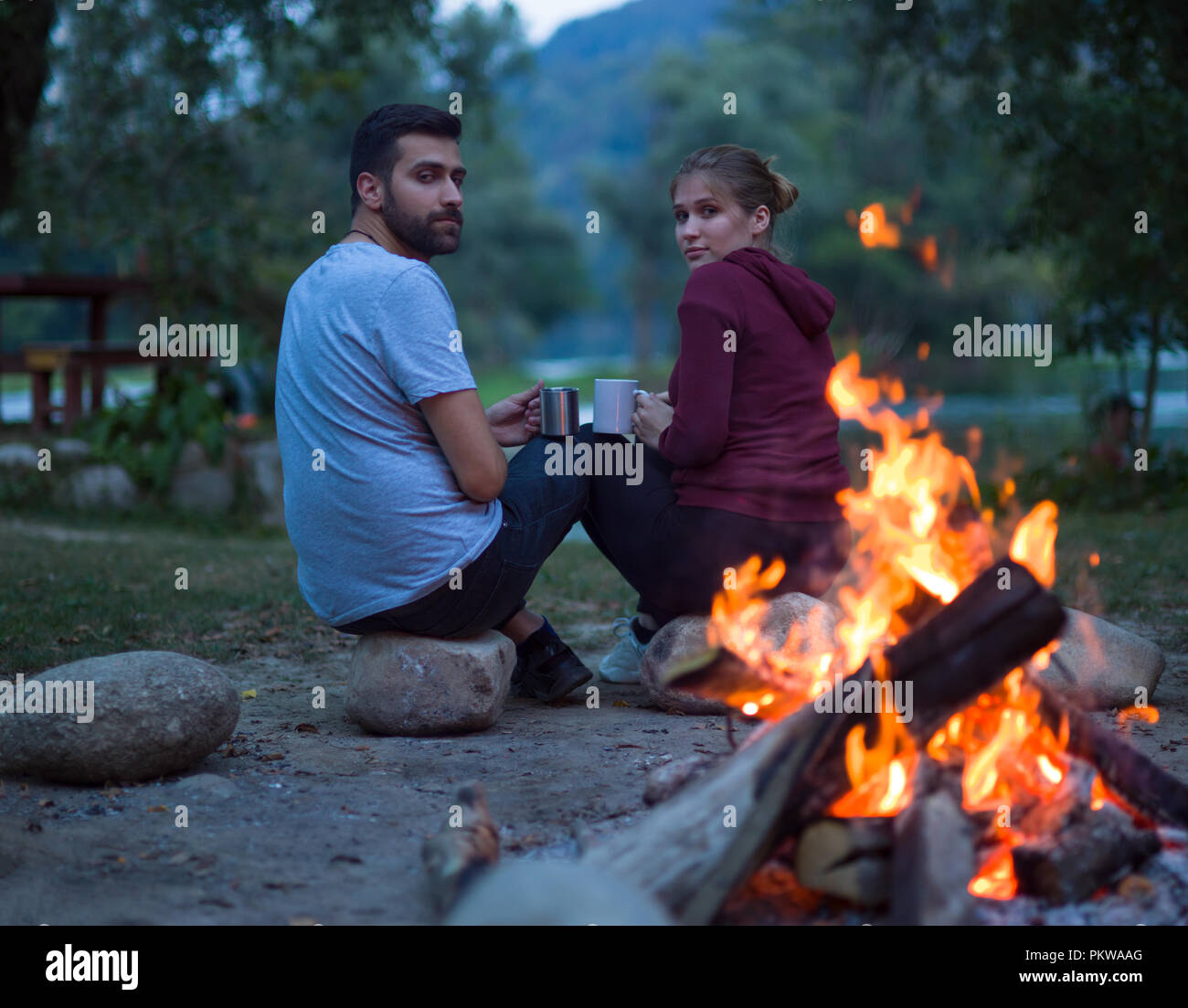 Couple Around A Campfire High Resolution Stock Photography and Images ...