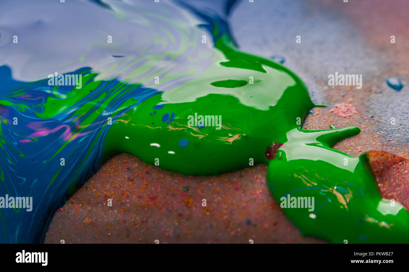 colorful of screen printing ink dropped on the ground made an abstract ...