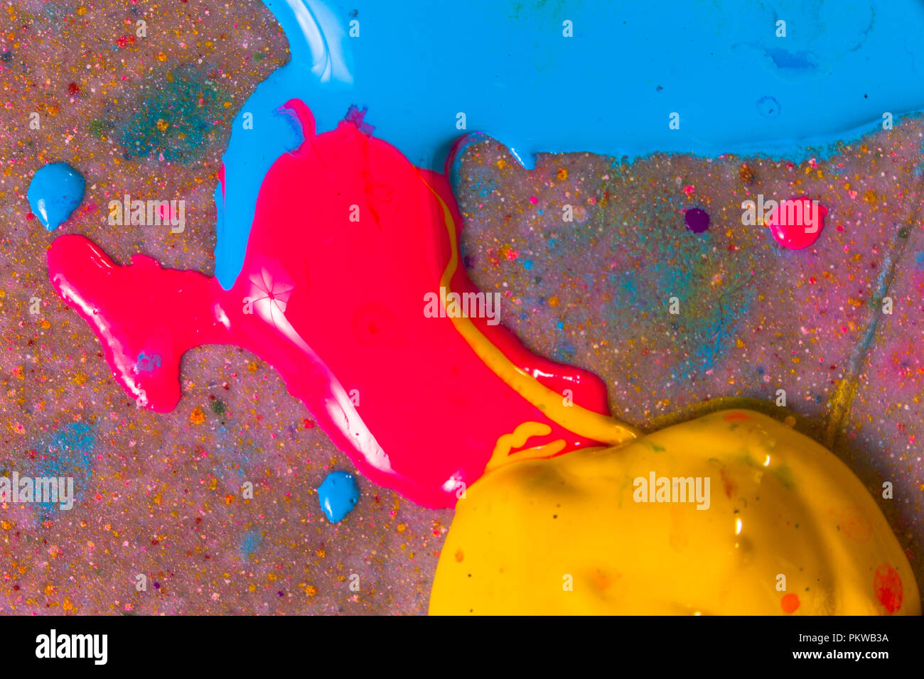 colorful of screen printing ink dropped on the ground made an abstract ...