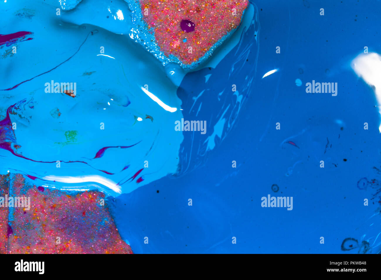 colorful of screen printing ink dropped on the ground made an abstract ...