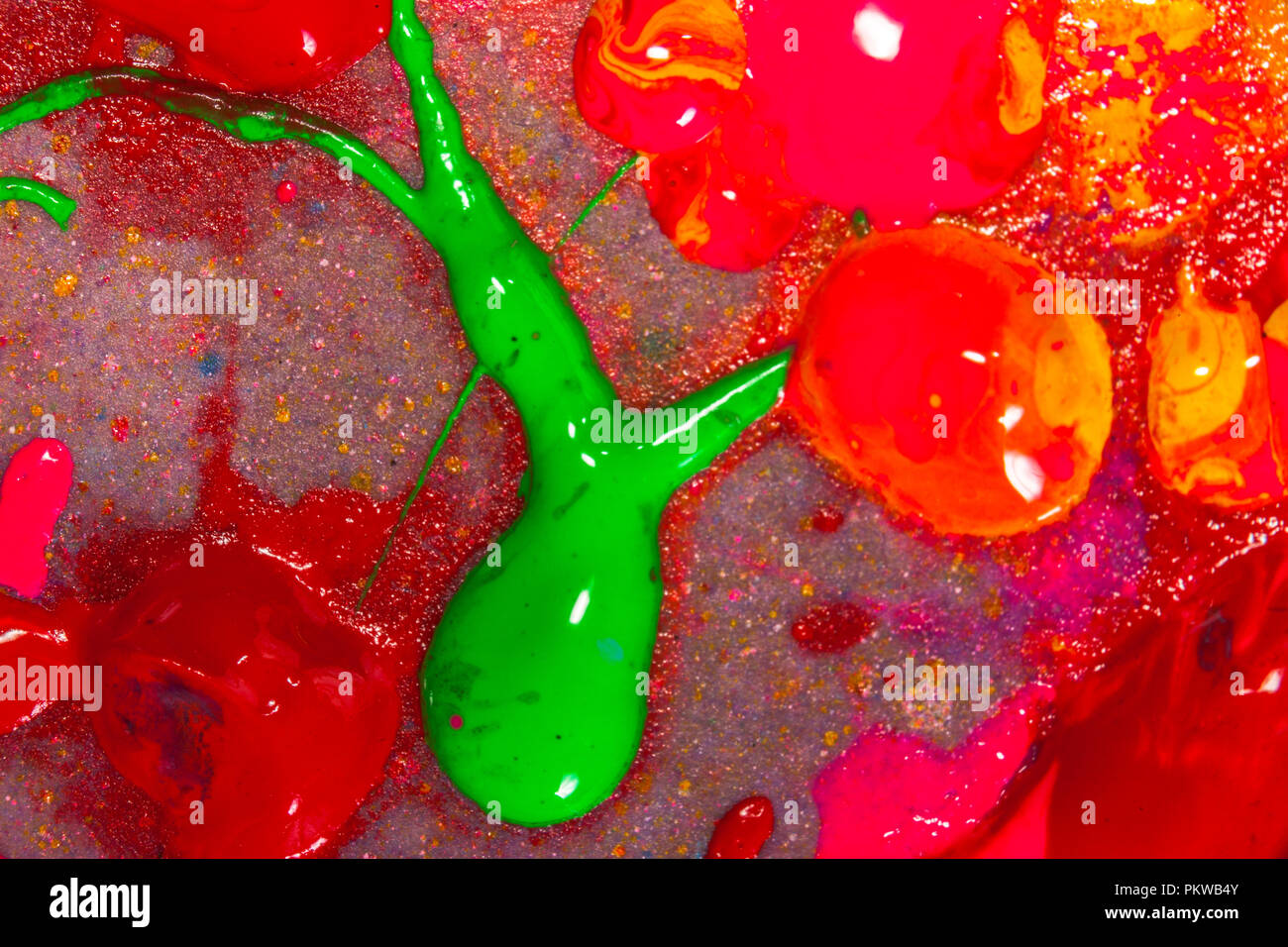 colorful of screen printing ink dropped on the ground made an abstract ...