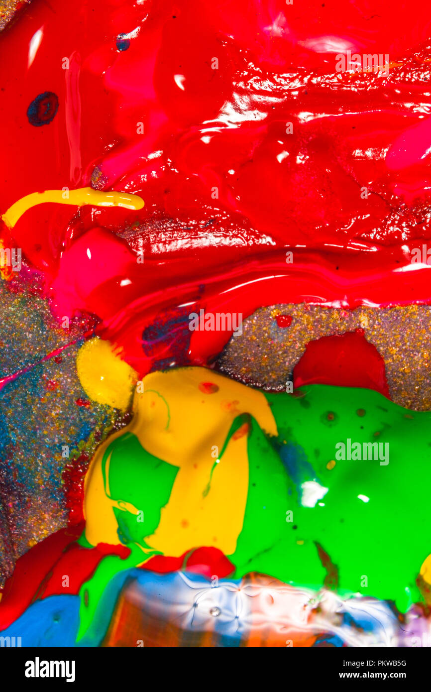 colorful of screen printing ink dropped on the ground made an abstract ...