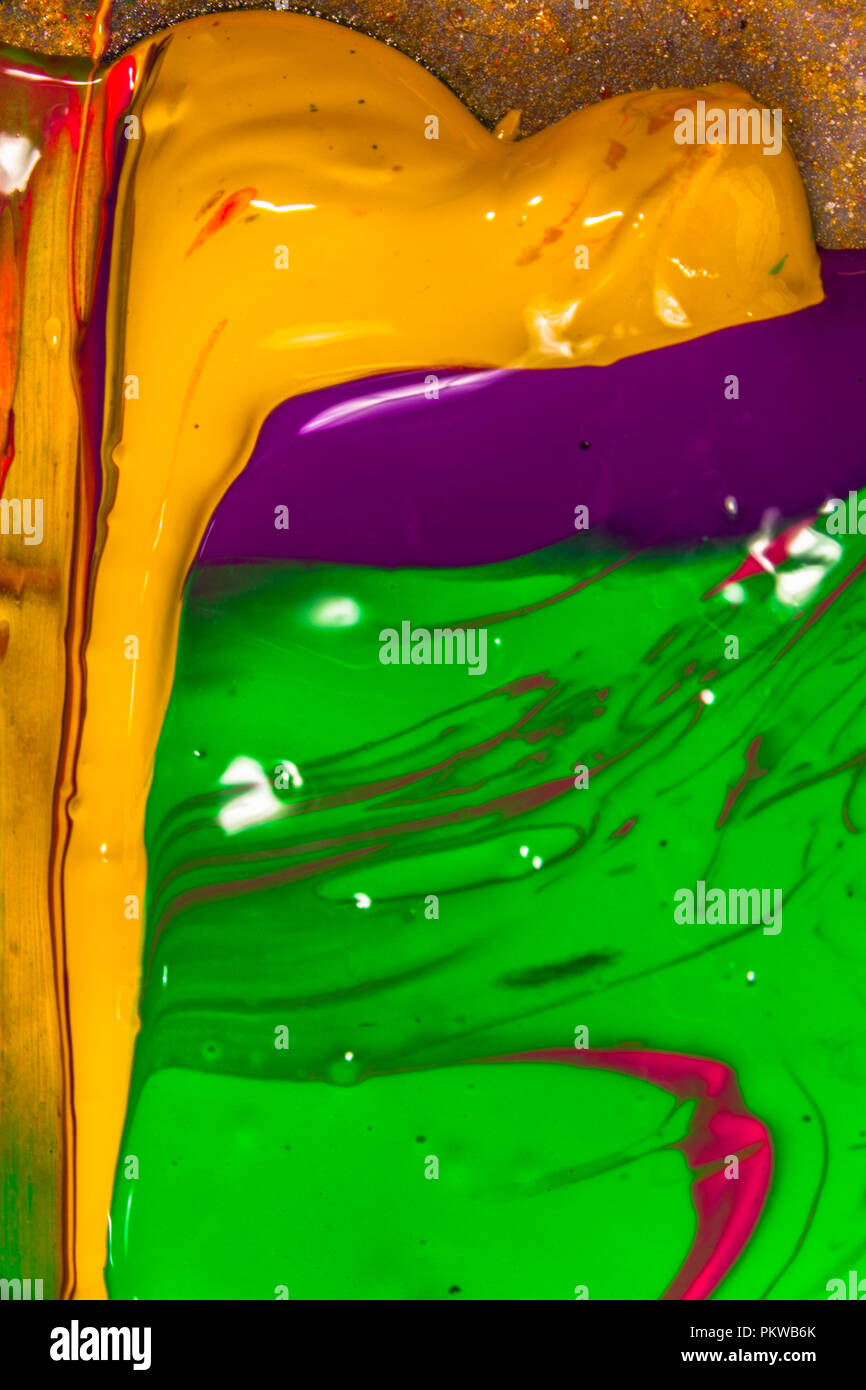 colorful of screen printing ink dropped on the ground made an abstract ...