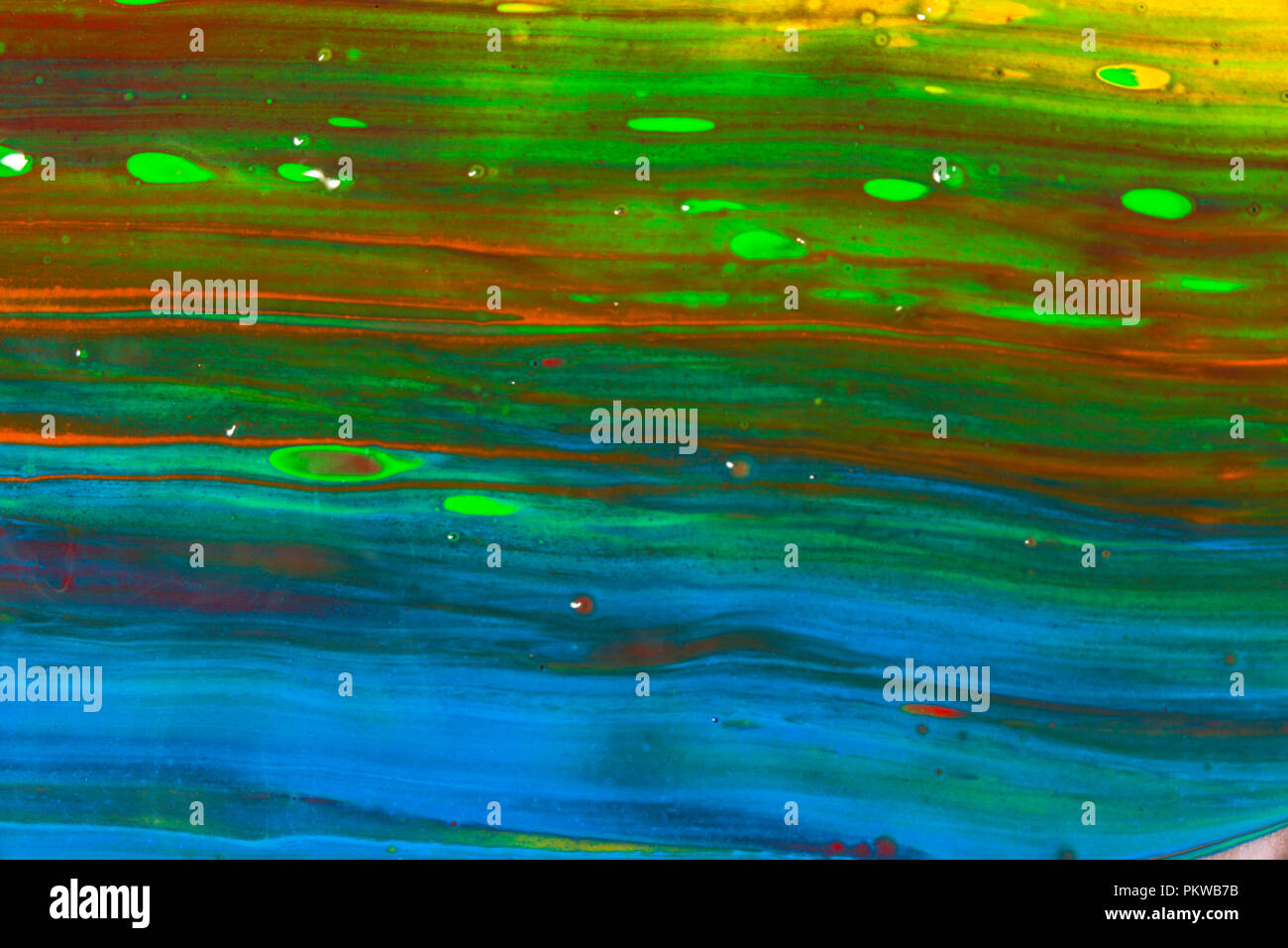 colorful of screen printing ink dropped on the ground made an abstract ...