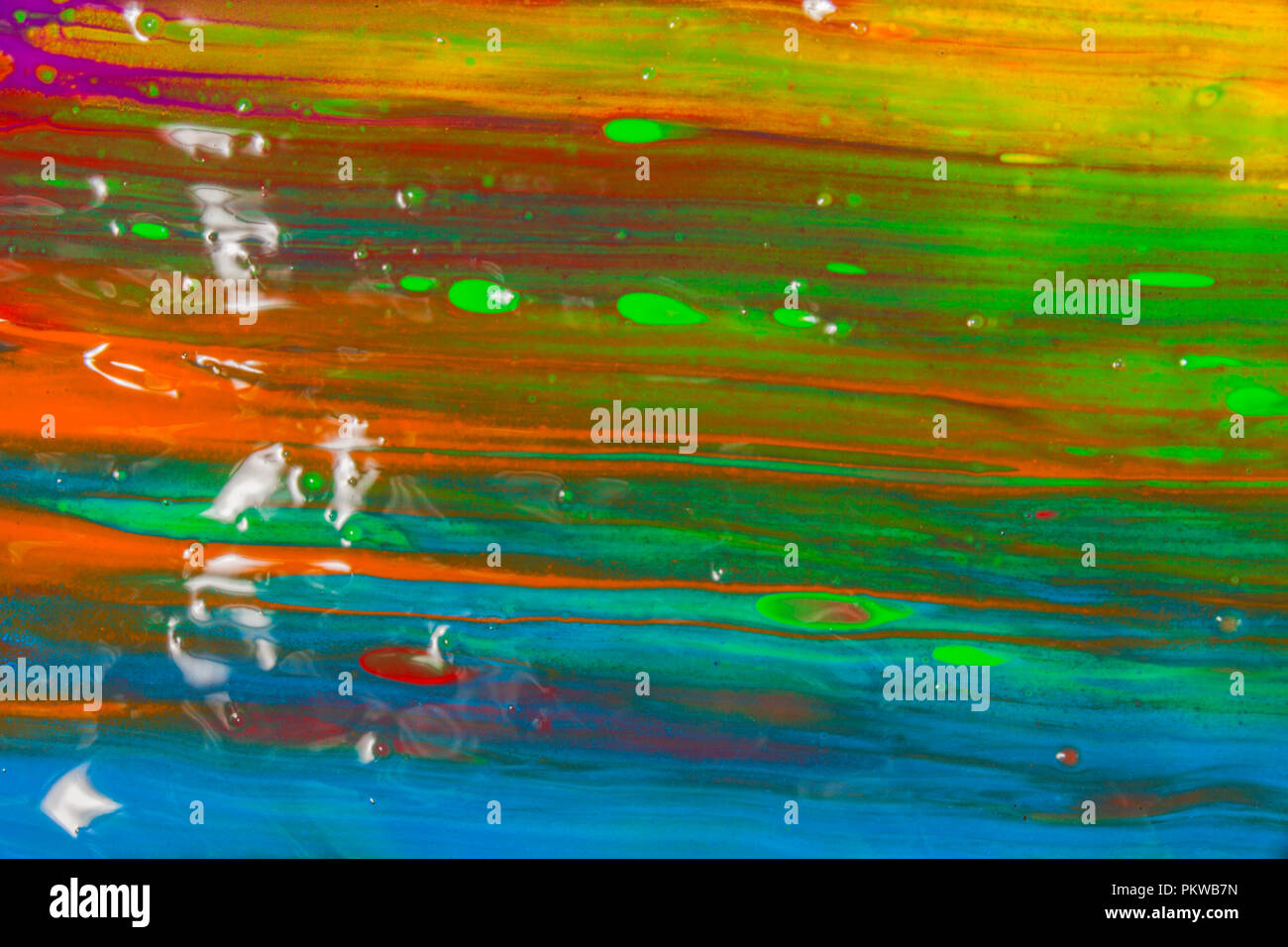 colorful of screen printing ink dropped on the ground made an abstract ...