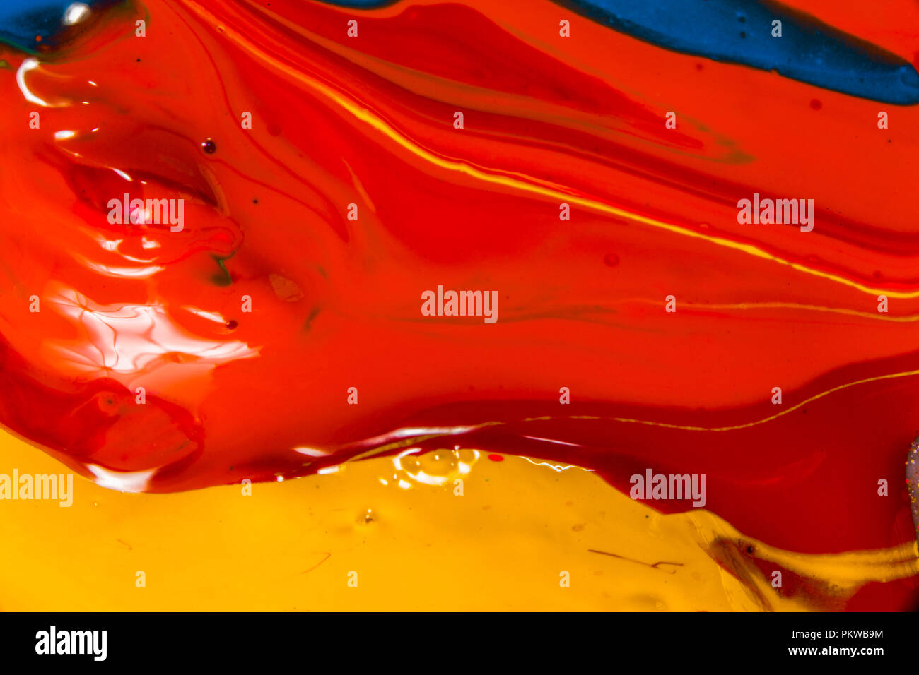 colorful of screen printing ink dropped on the ground made an abstract ...