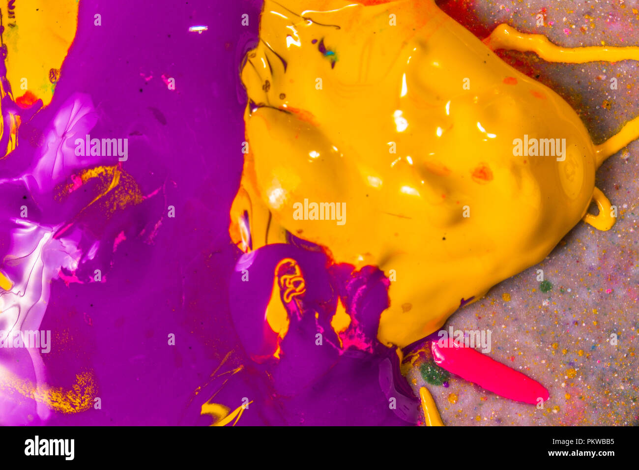 colorful of screen printing ink dropped on the ground made an abstract ...