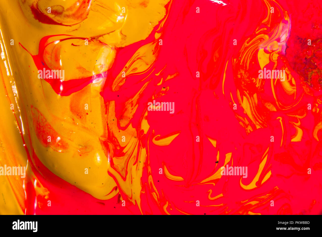colorful of screen printing ink dropped on the ground made an abstract ...