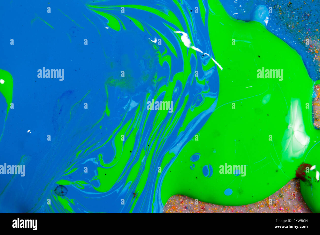 colorful of screen printing ink dropped on the ground made an abstract ...