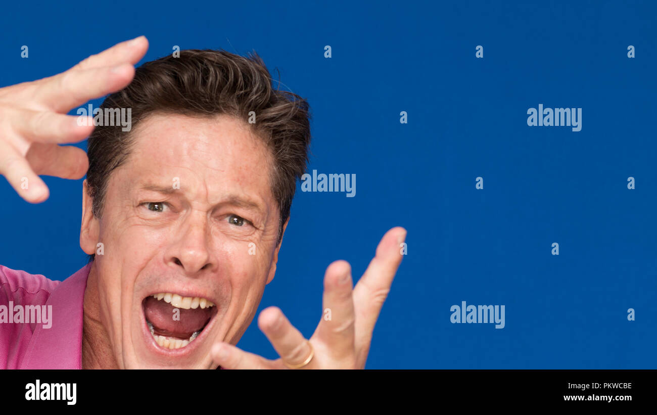 Happy winner. Happy mature man winner Stock Photo - Alamy