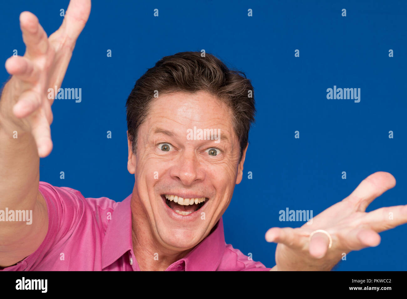 Happy winner. Happy mature man winner Stock Photo - Alamy