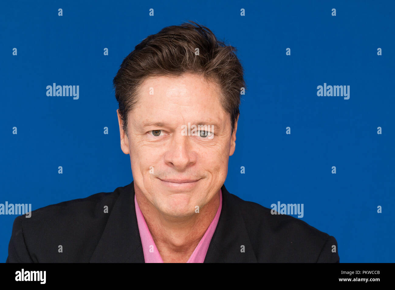 A handsome middle-aged man with a happy face Stock Photo - Alamy