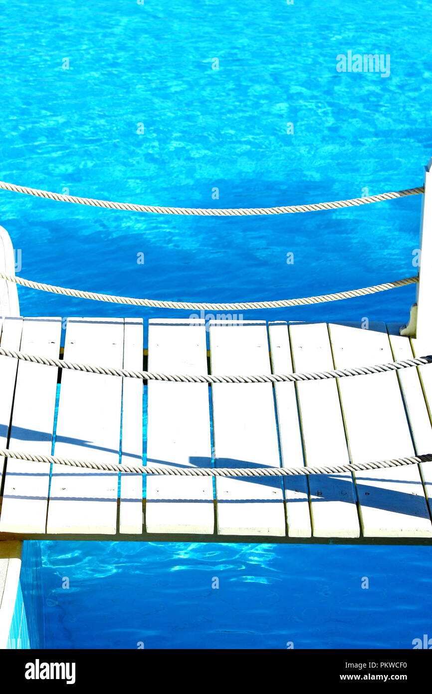 Detail of bridge on a swimming pool Stock Photo - Alamy