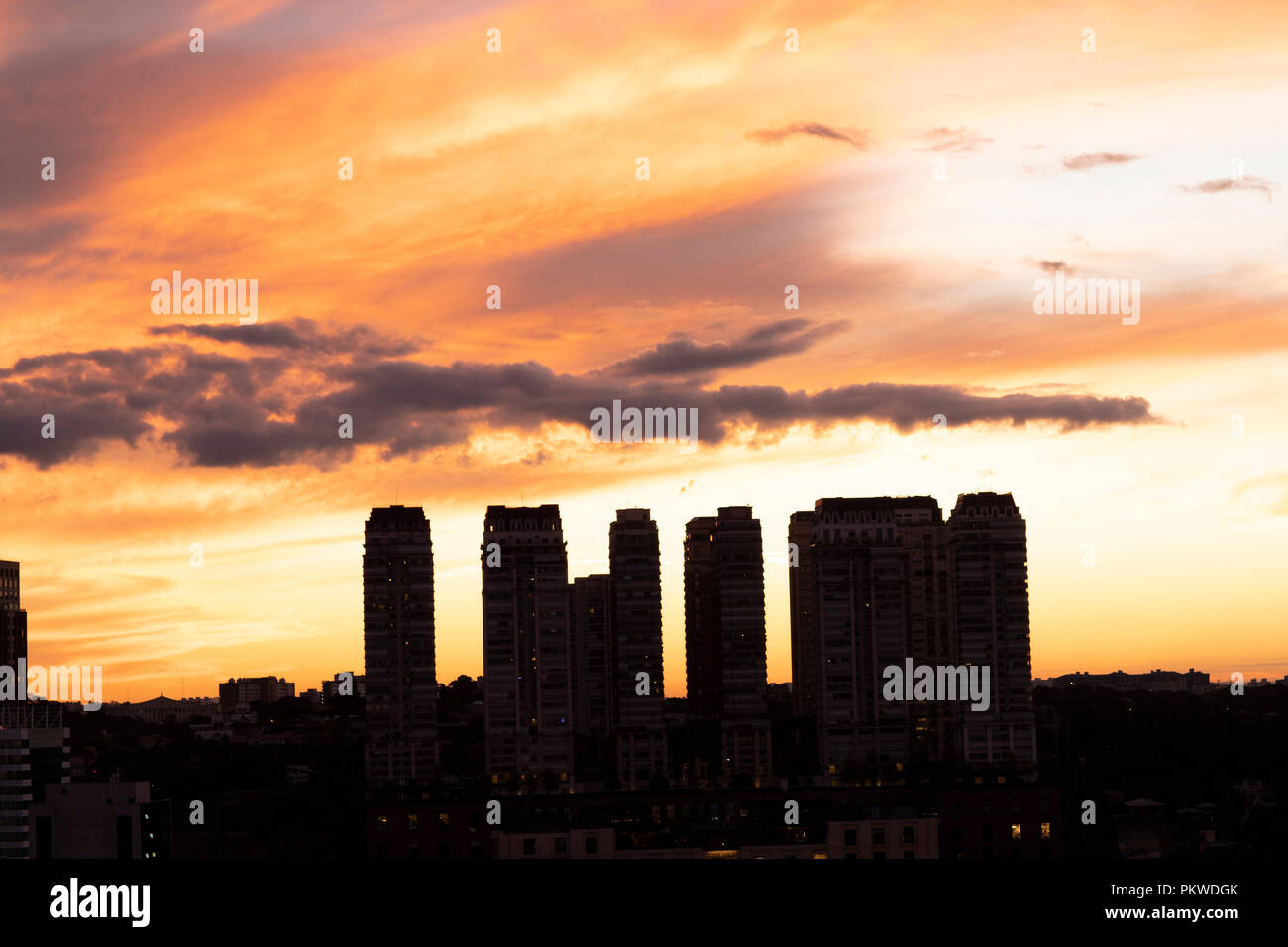 Sunrise between buildings Stock Photo - Alamy