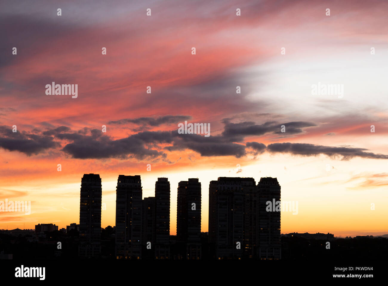 Sunrise between buildings Stock Photo - Alamy
