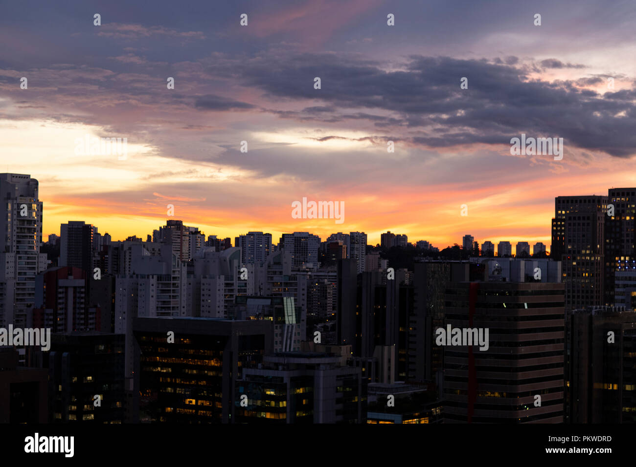 Sunrise between buildings Stock Photo - Alamy