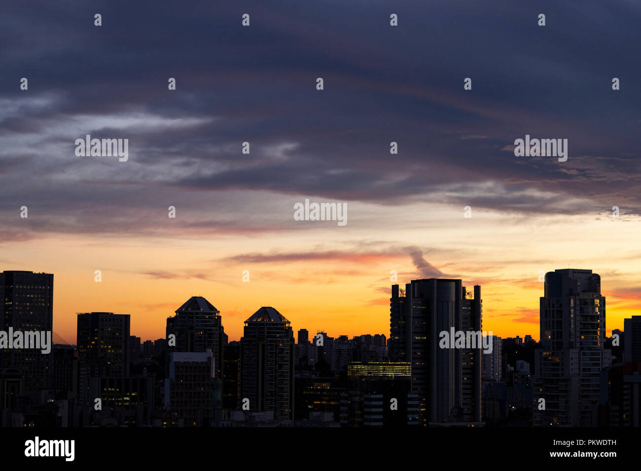 Sunrise between buildings Stock Photo - Alamy