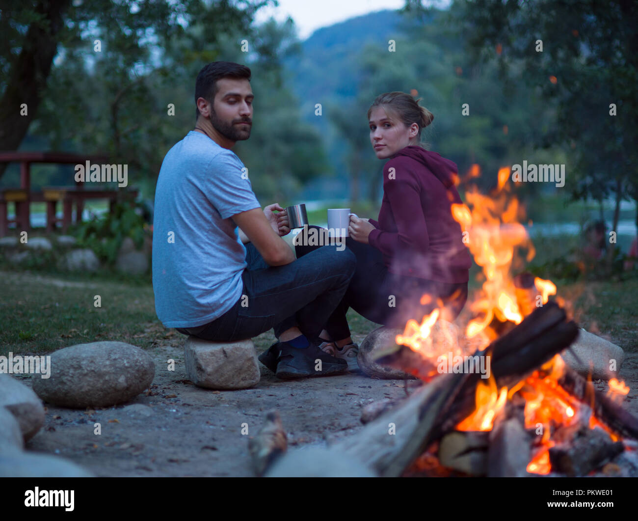 Couple Around A Campfire High Resolution Stock Photography and Images ...