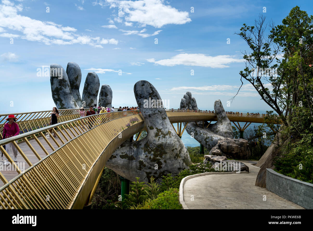 The Golden Bridge is lifted by two giant hands in the tourist resort on ...