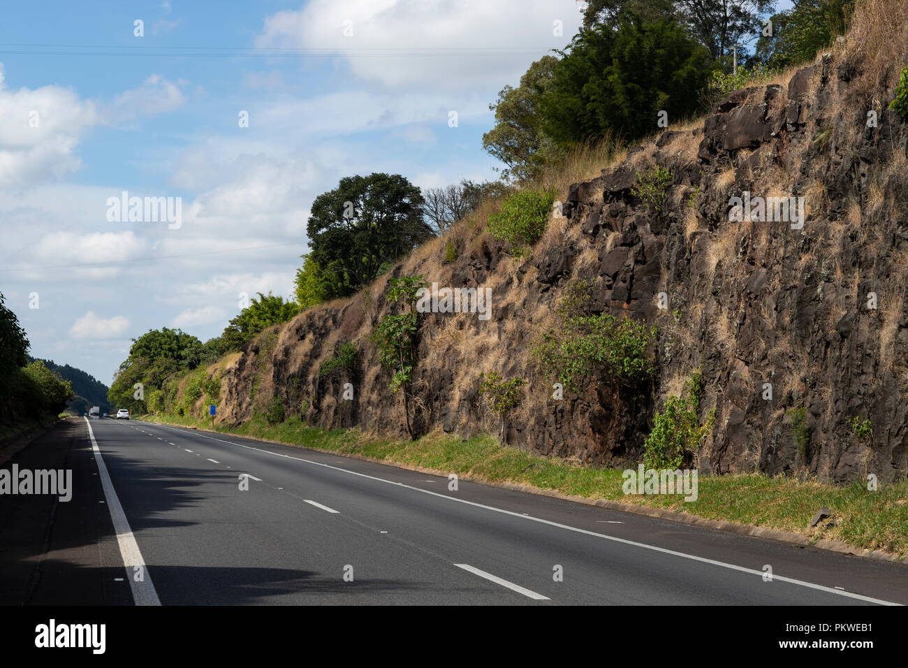 Road with stone walls Stock Photo - Alamy