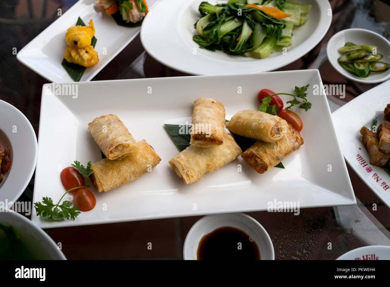 Vietnamese rice with vegetables and fried spring rolls Stock Photo - Alamy
