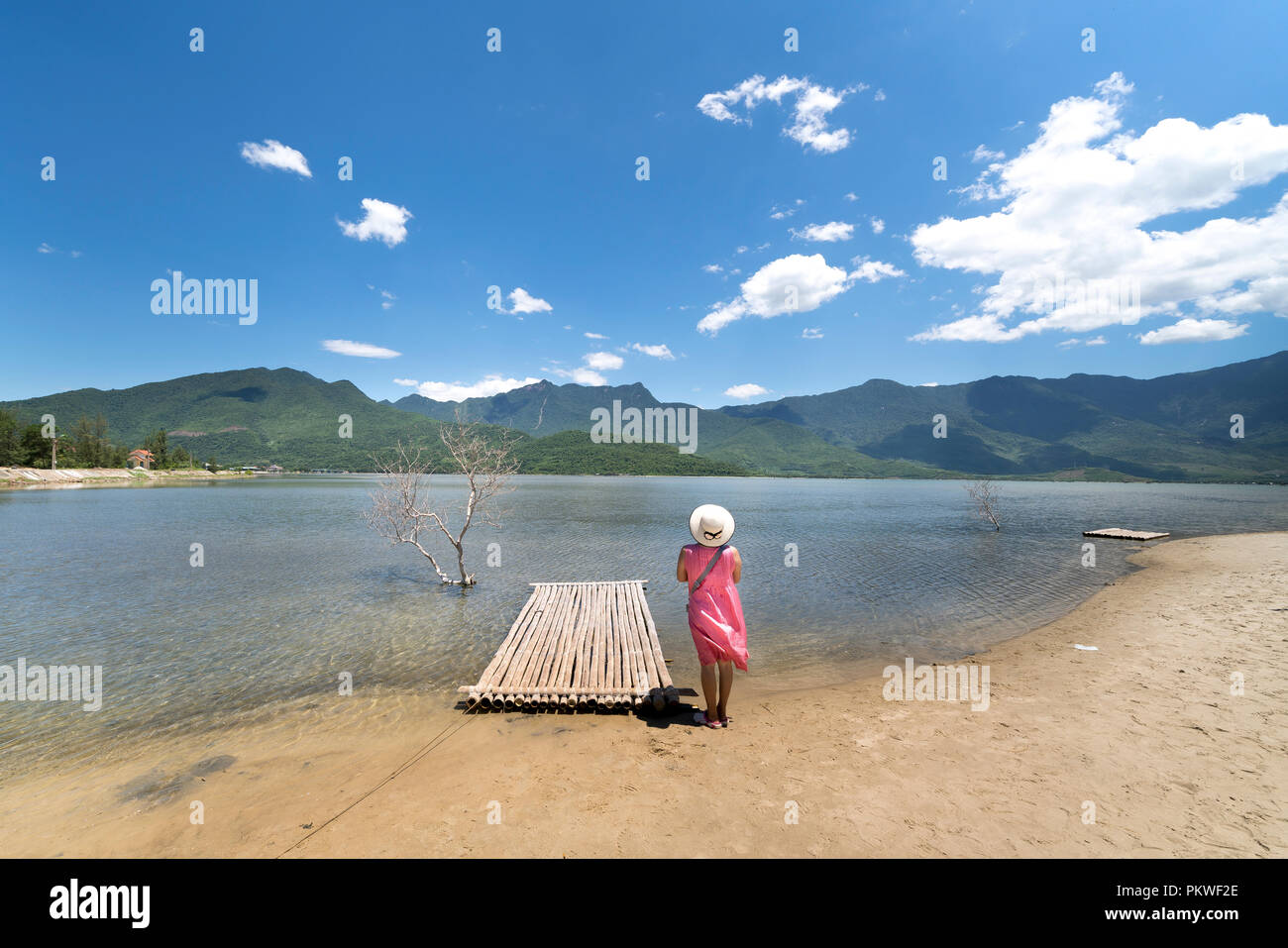 Tourists walk on the sand at Lap An lagoon Stock Photo - Alamy