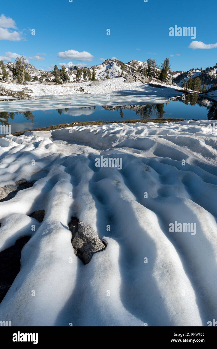 Patterns of melting snow by a sub-alpine lake in early summer, Wallowa ...