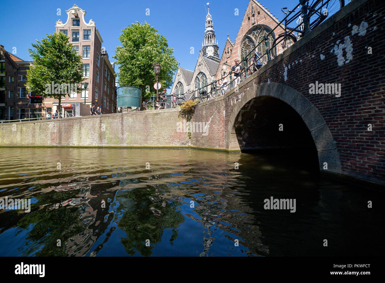 Amsterdam, Netherlands - July 02, 2018: Bridge over the river channel ...