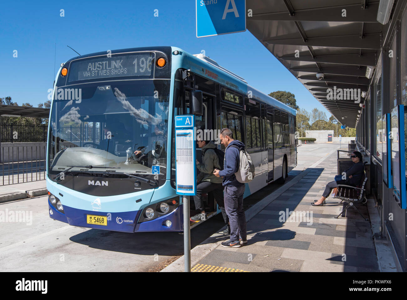 People boarding a public transport bus at the new train and bus ...