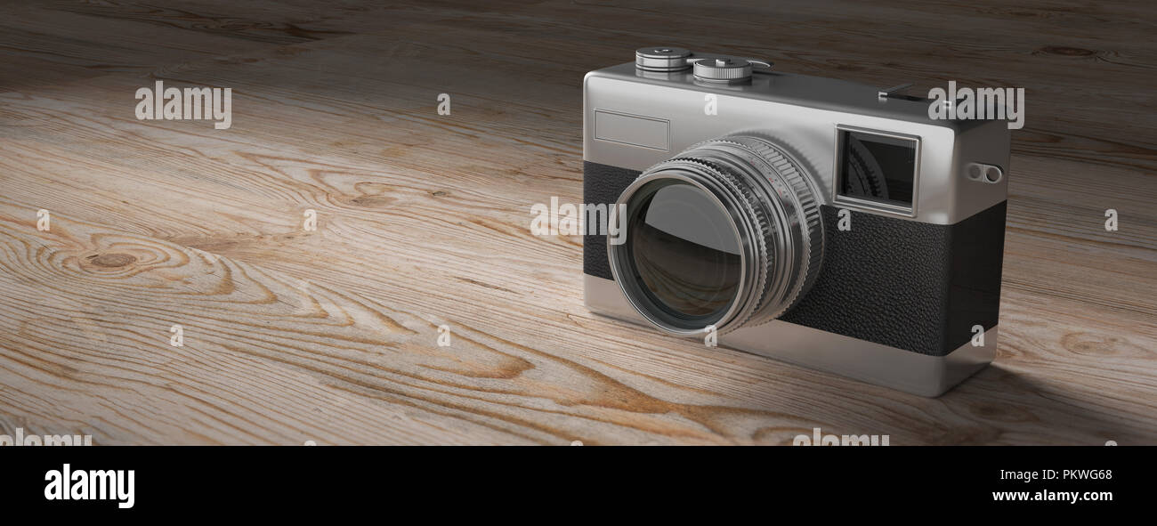 Vintage concept. Isolated retro camera on white wooden background, copy ...