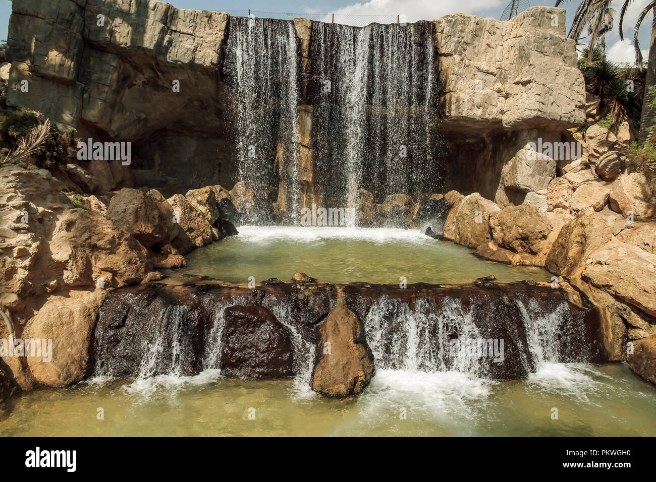 horizontal view of waterfall of el palmeral park in the city of ...