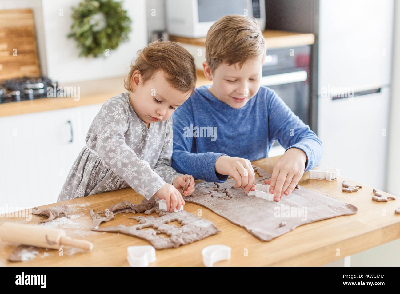 Children making christmas cookies at home kitchen. Family christmas ...