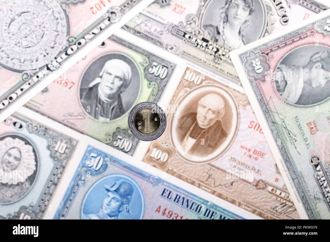 Peso coin on the background of old Mexican banknotes Stock Photo - Alamy