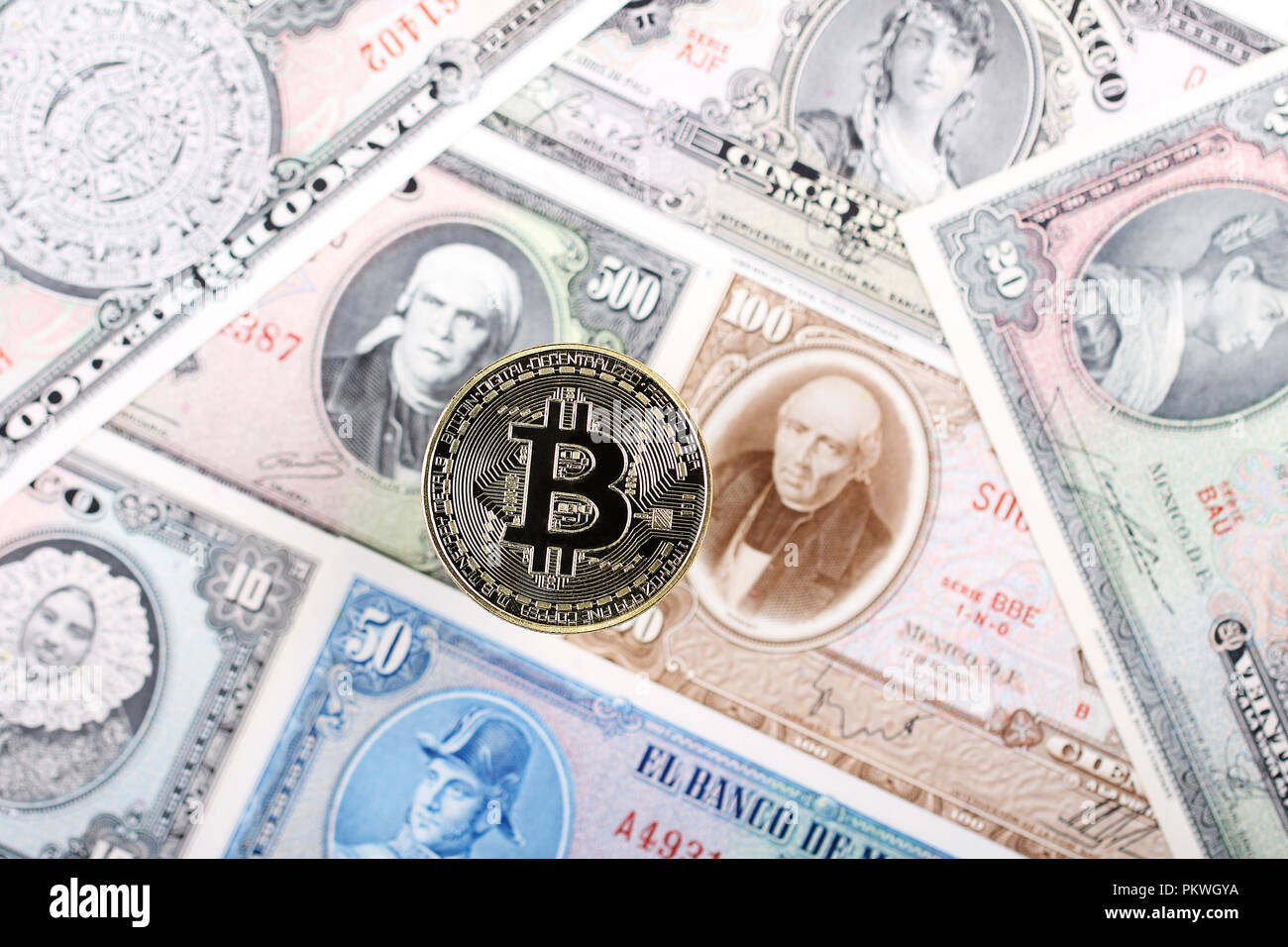 Bitcoin coin on the background of old Mexican banknotes Stock Photo - Alamy