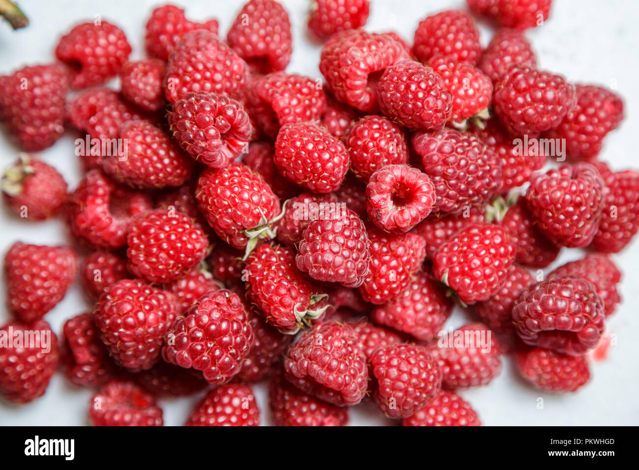 Fresh and sweet raspberries background Stock Photo - Alamy