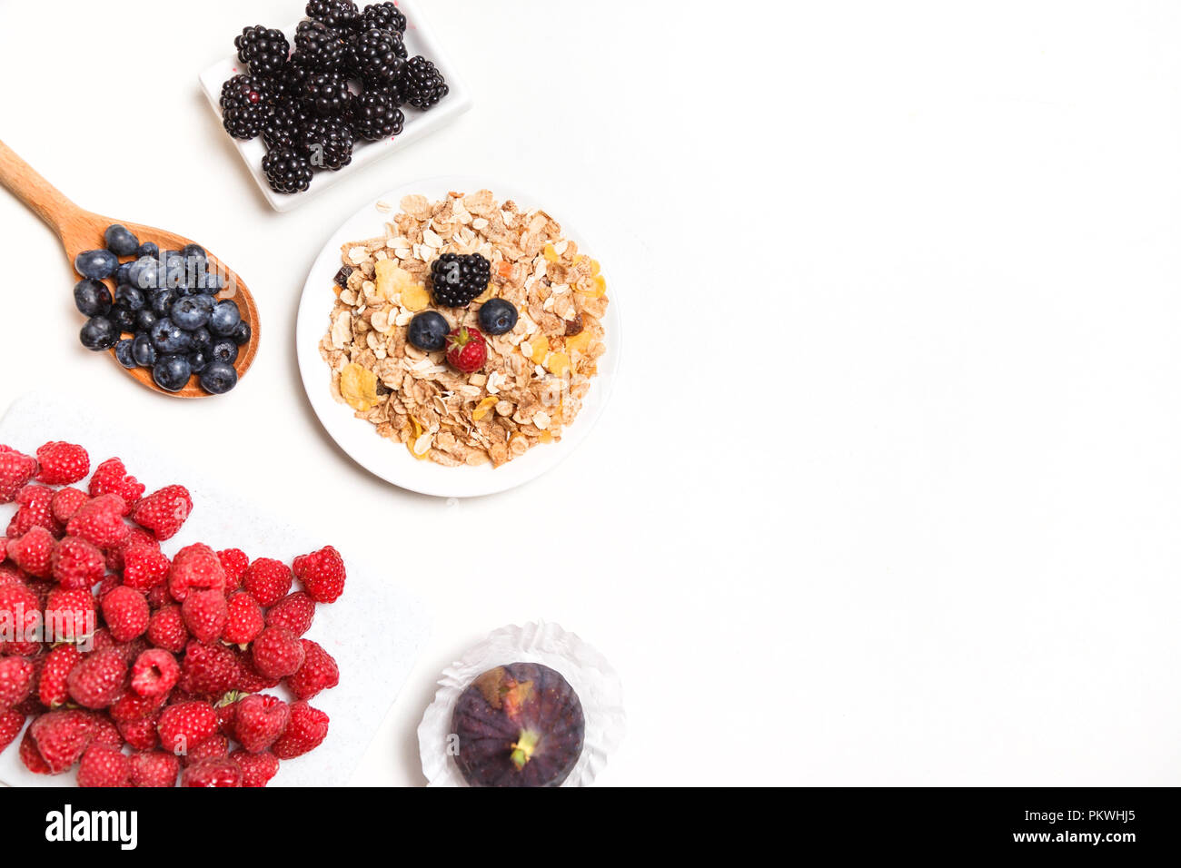 bowl of corn flakes with berries on white background Stock Photo - Alamy