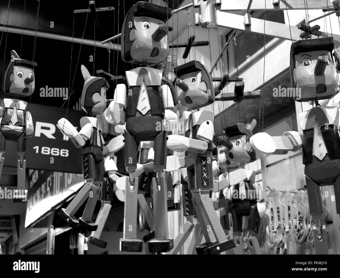 Puppets of Pinocchio hanging outside a shop Stock Photo - Alamy