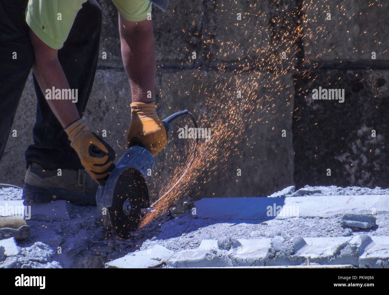 Employee worker with grinding machine Stock Photo - Alamy